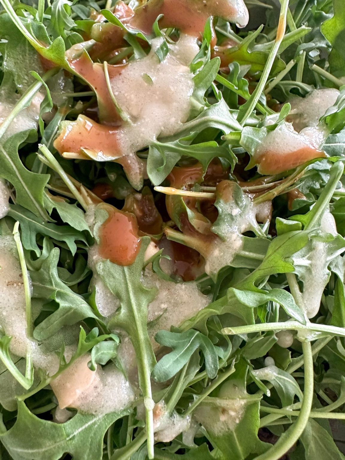 arugula salad with goat cheese, balsamic glaze & honey almonds